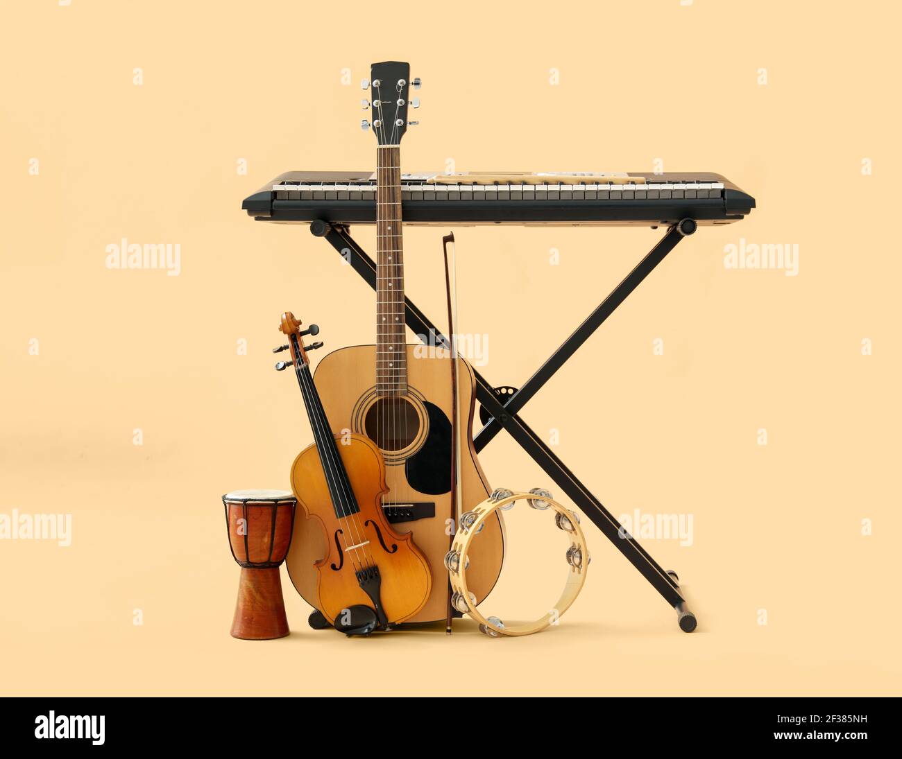 Different musical instruments on color background Stock Photo - Alamy