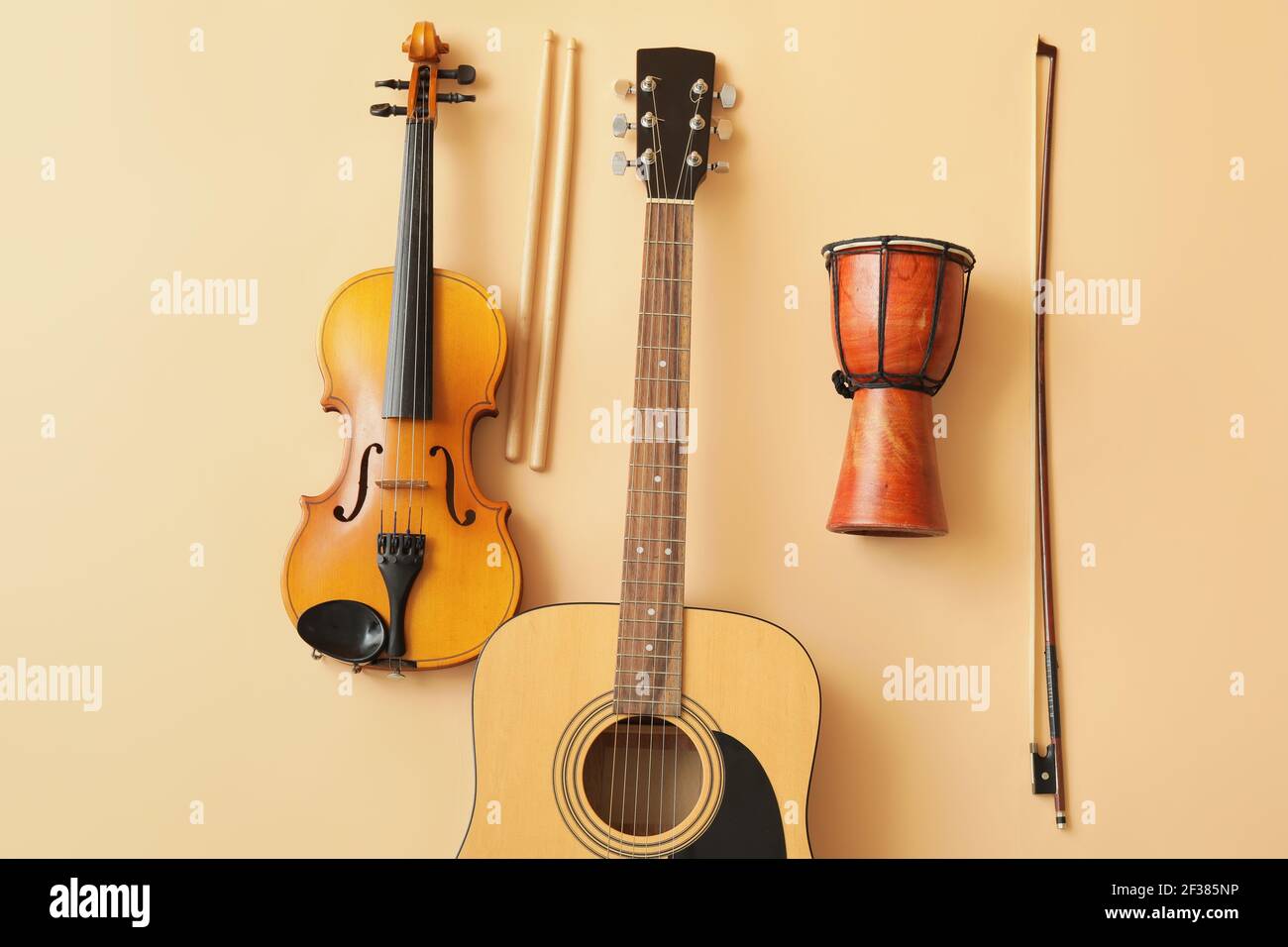 Different musical instruments on color background Stock Photo - Alamy