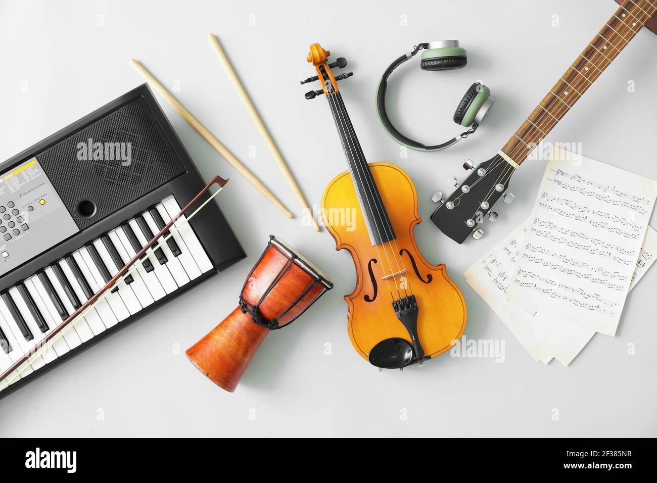 Different musical instruments and music notes on light background Stock ...