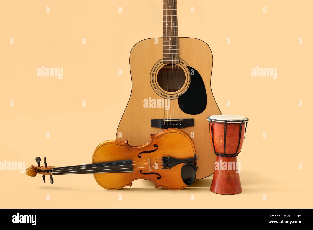 Different musical instruments on color background Stock Photo - Alamy