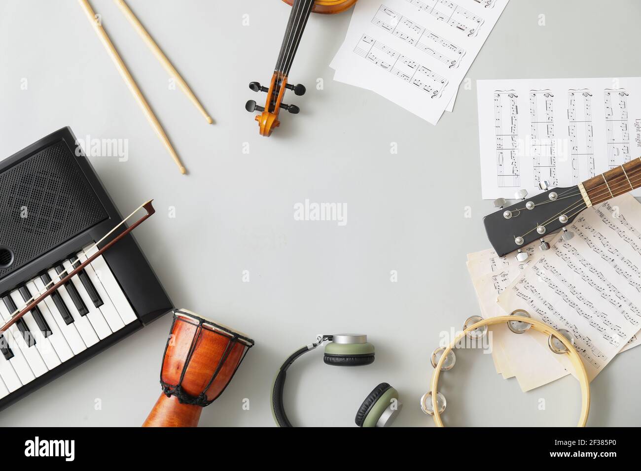 Frame made of different musical instruments and music notes on light ...