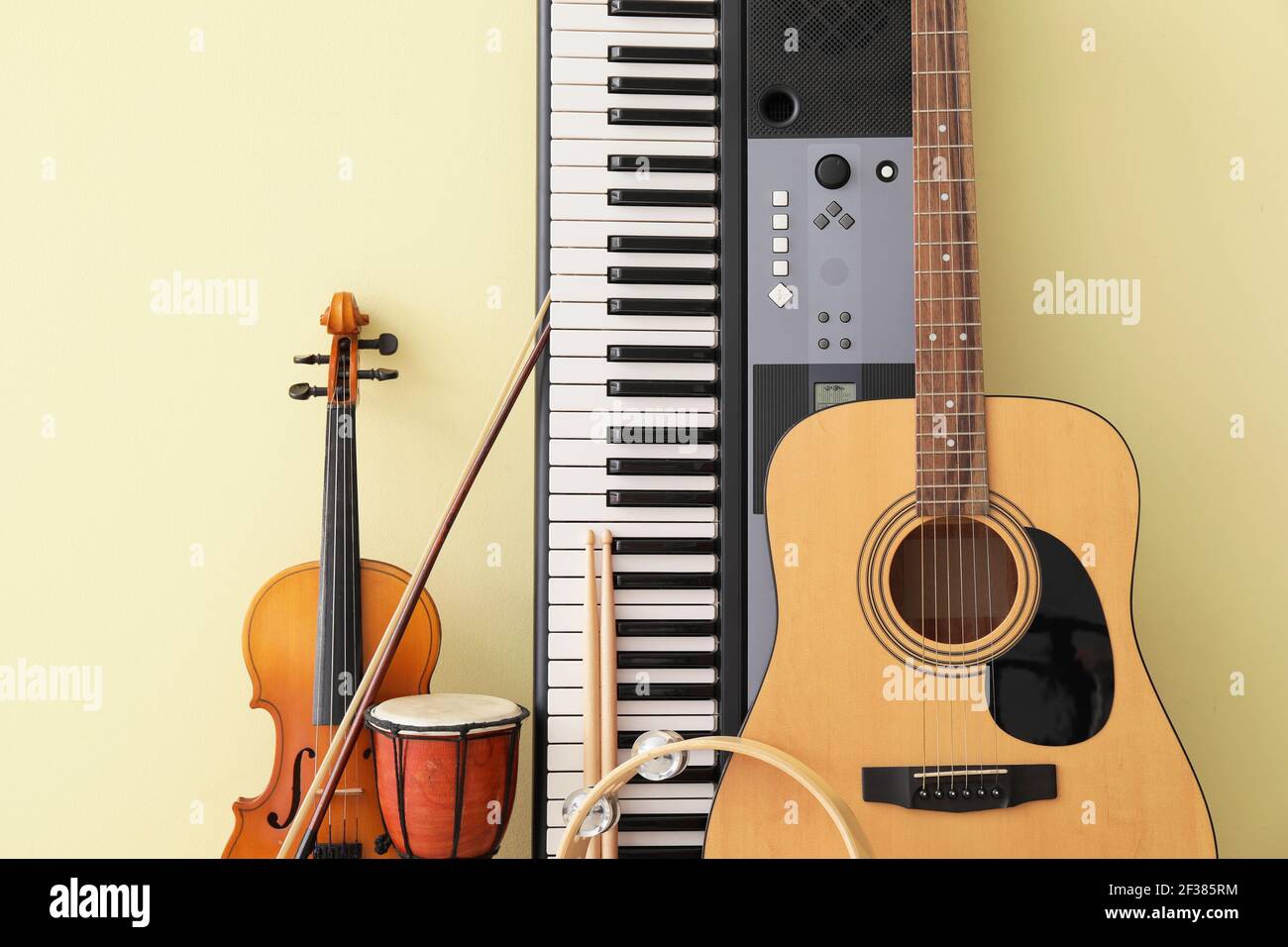 Different musical instruments on color background Stock Photo - Alamy