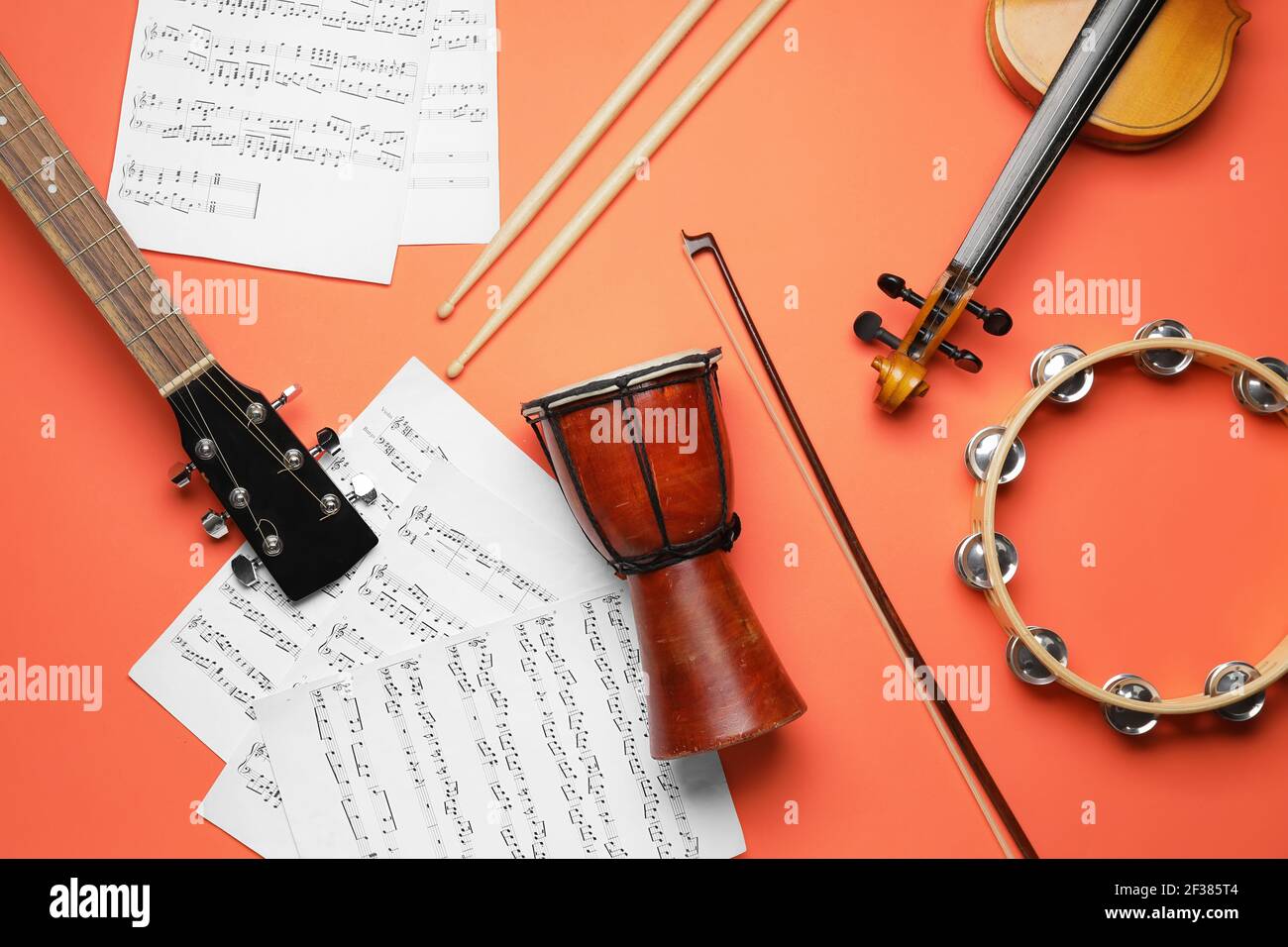 Different musical instruments and music notes on color background Stock ...