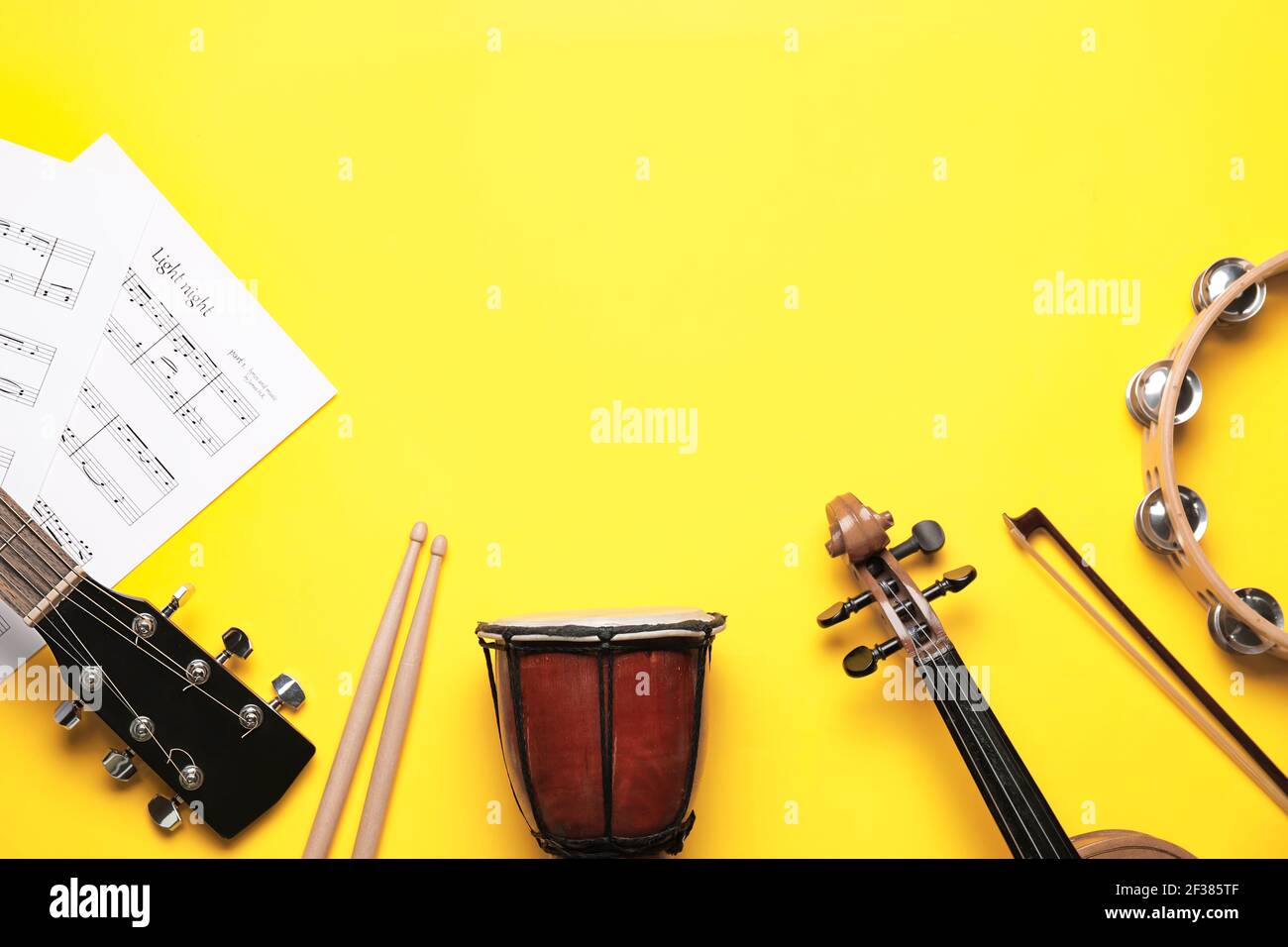 Different musical instruments and music notes on color background Stock ...