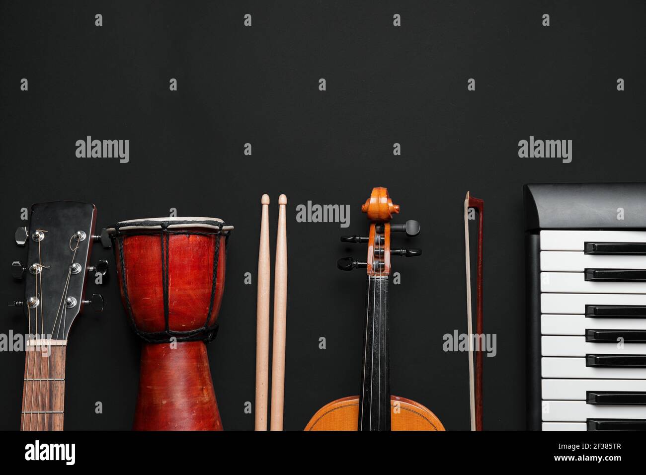 Different musical instruments on dark background Stock Photo - Alamy