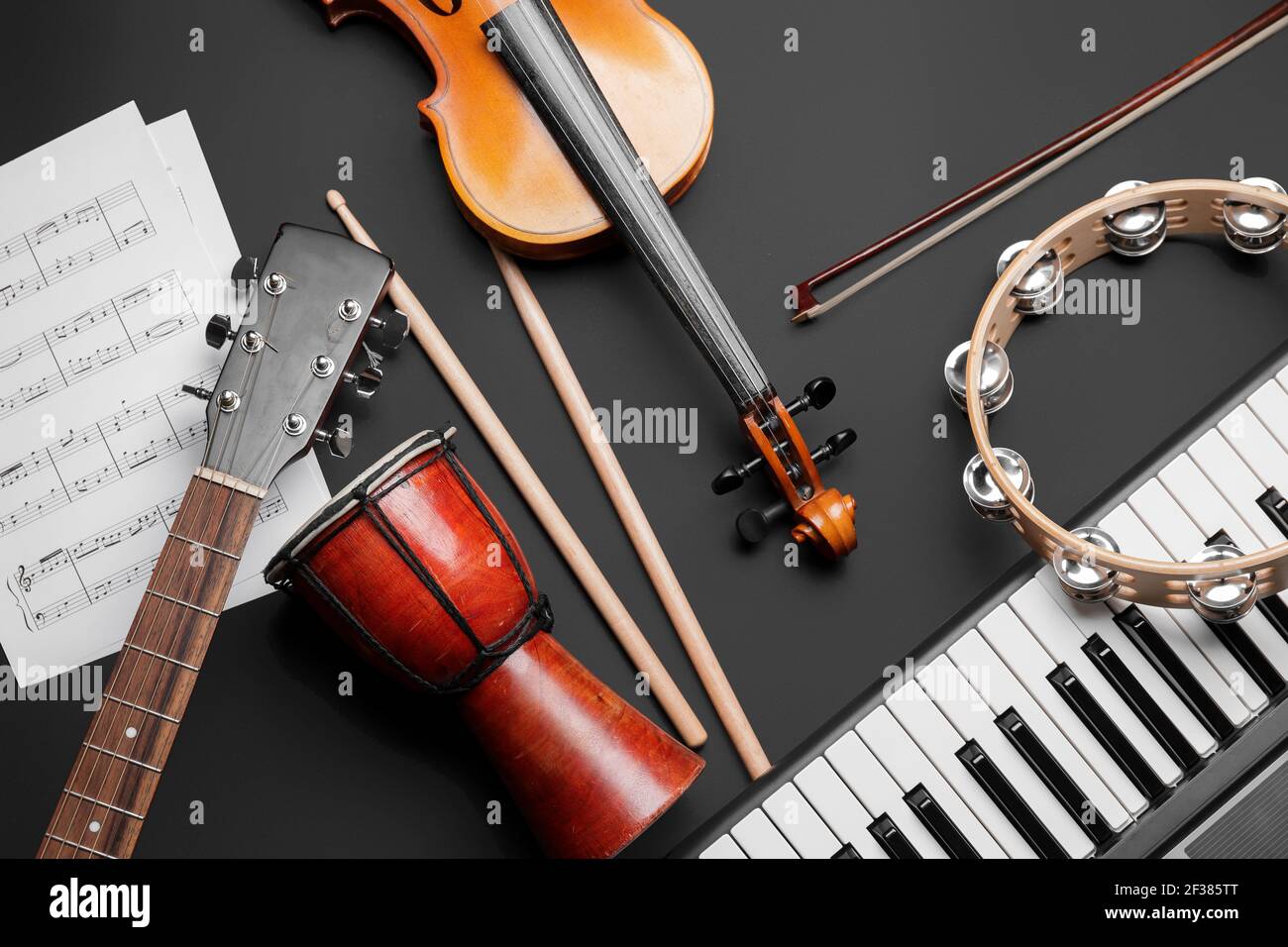 Different musical instruments and music notes on dark background Stock ...