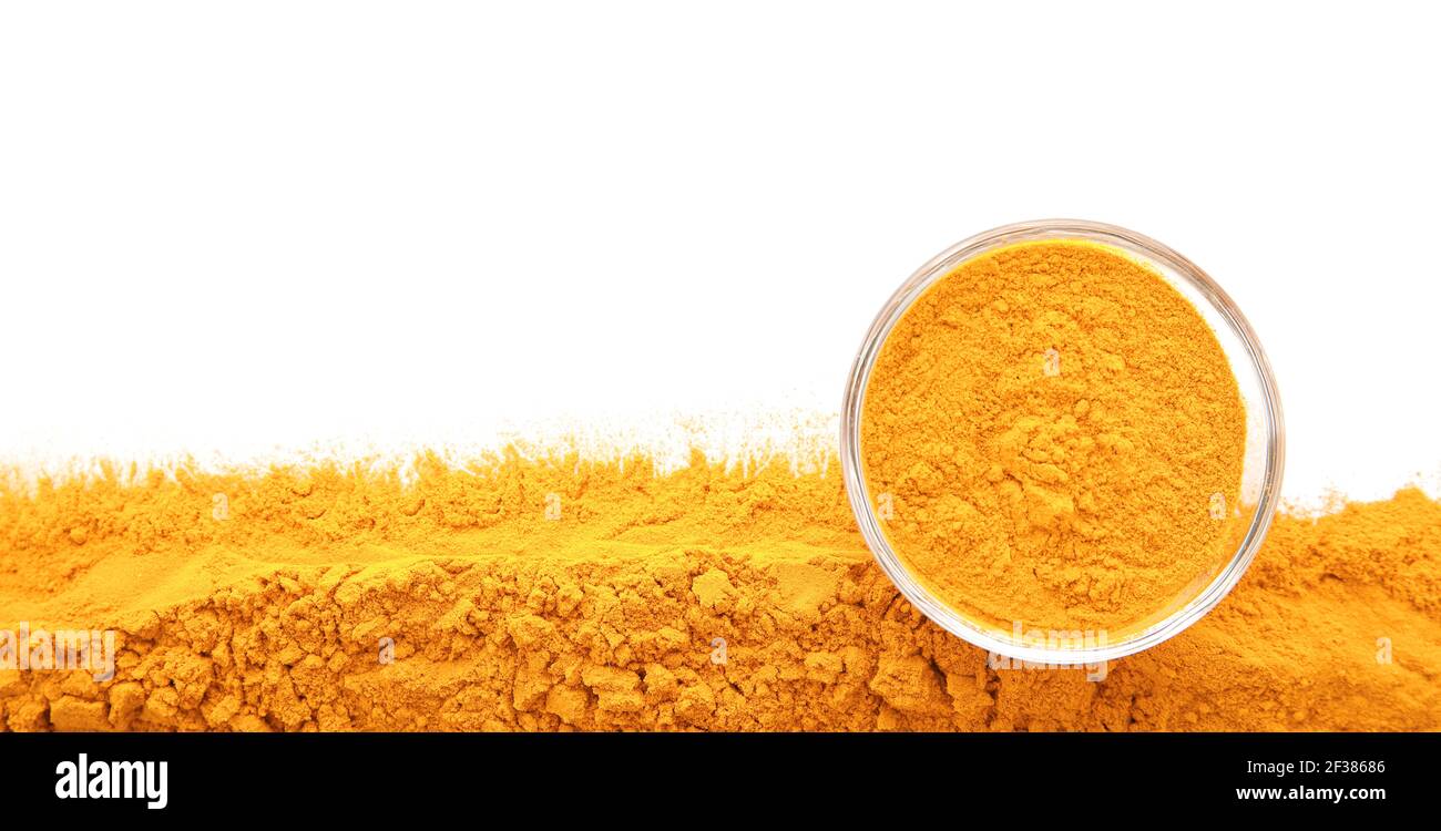 Bowl with turmeric powder on white background Stock Photo - Alamy