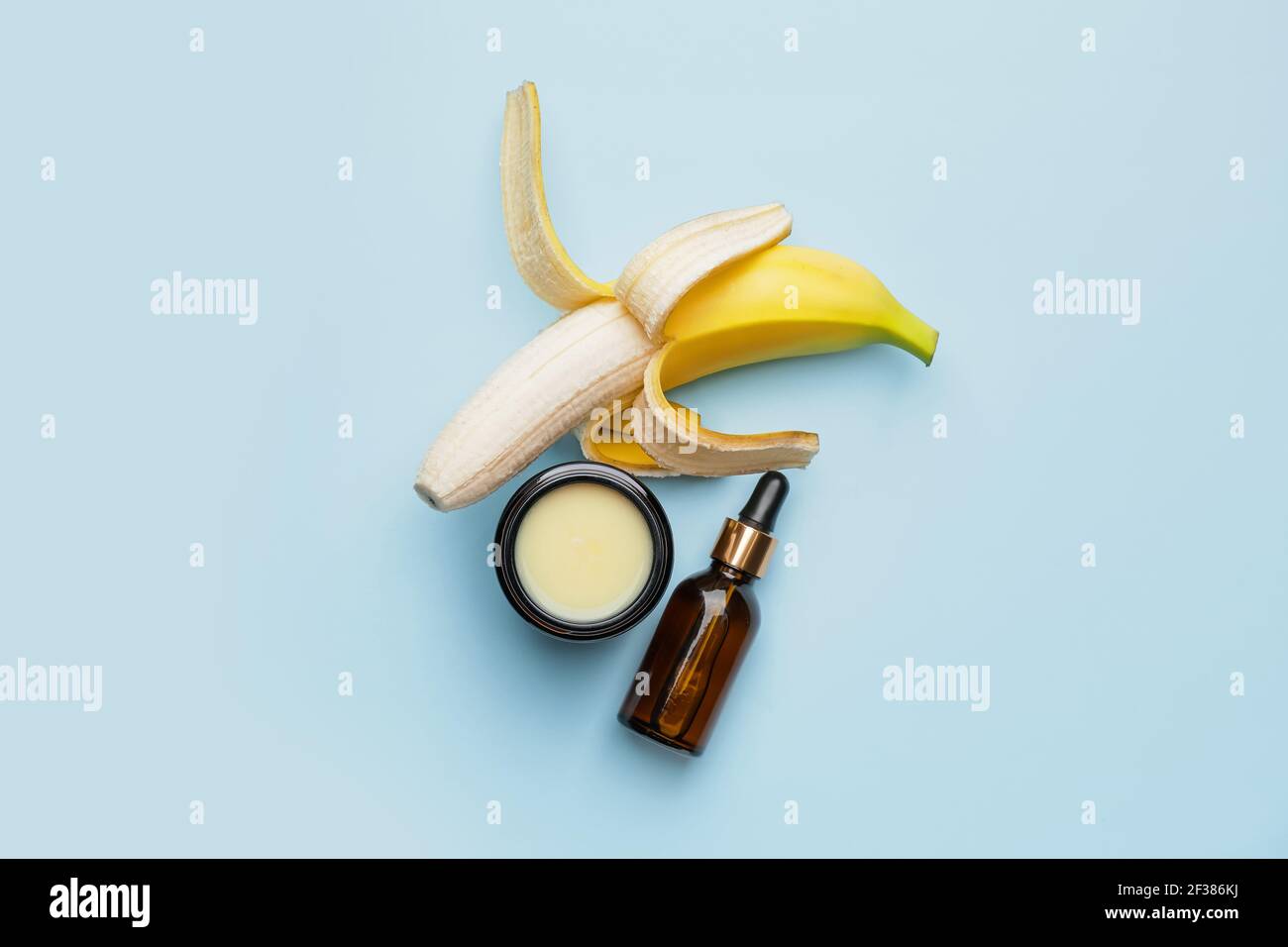 Natural banana cosmetics on color background Stock Photo - Alamy