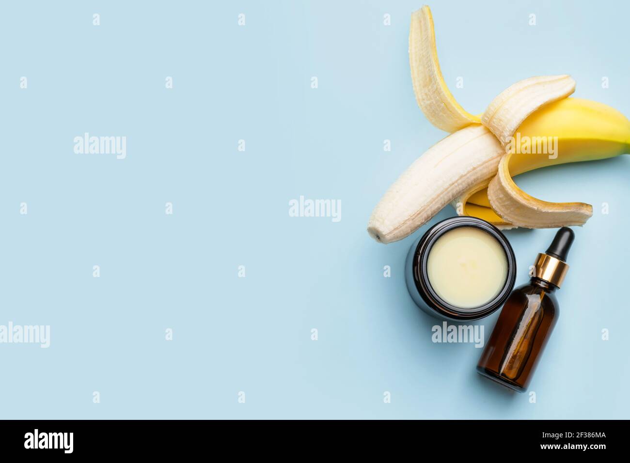 Natural banana cosmetics on color background Stock Photo - Alamy