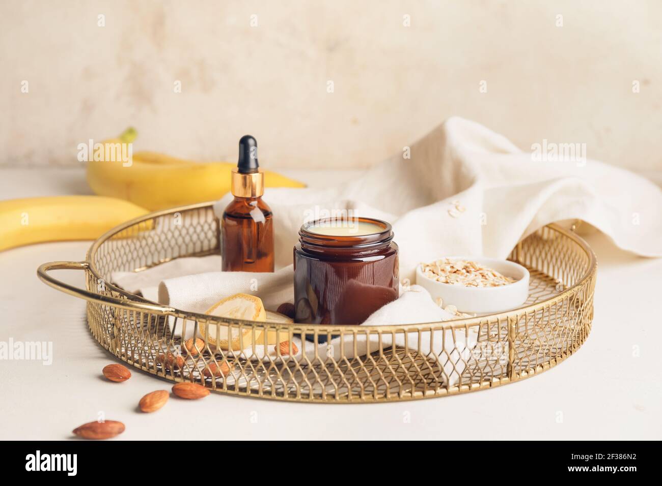 Composition with banana cosmetics on light background Stock Photo - Alamy