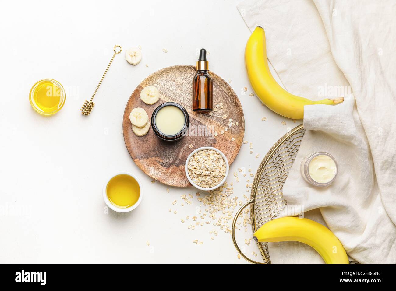 Composition with banana cosmetics on light background Stock Photo - Alamy