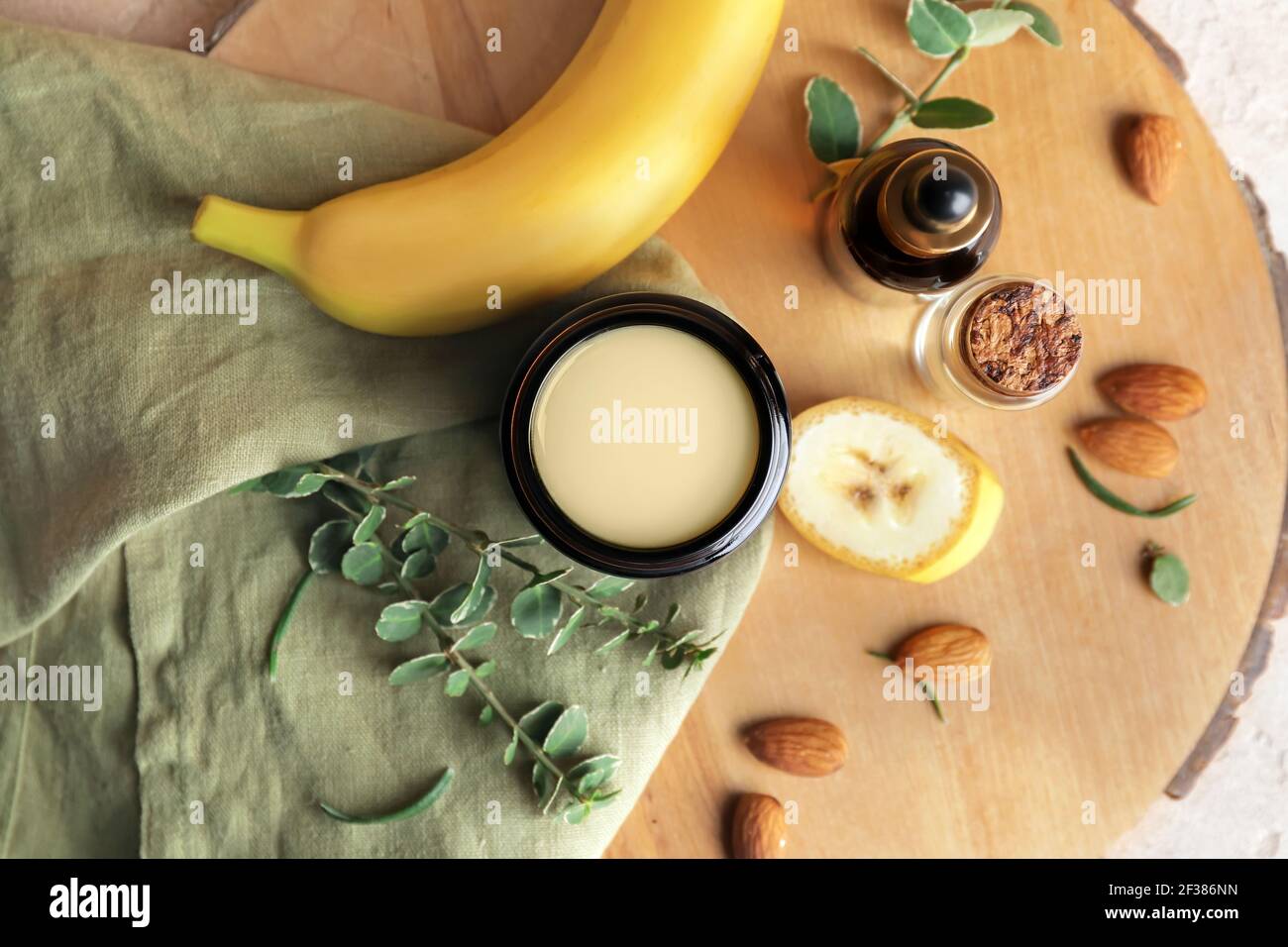 Composition with banana cosmetics on table Stock Photo - Alamy