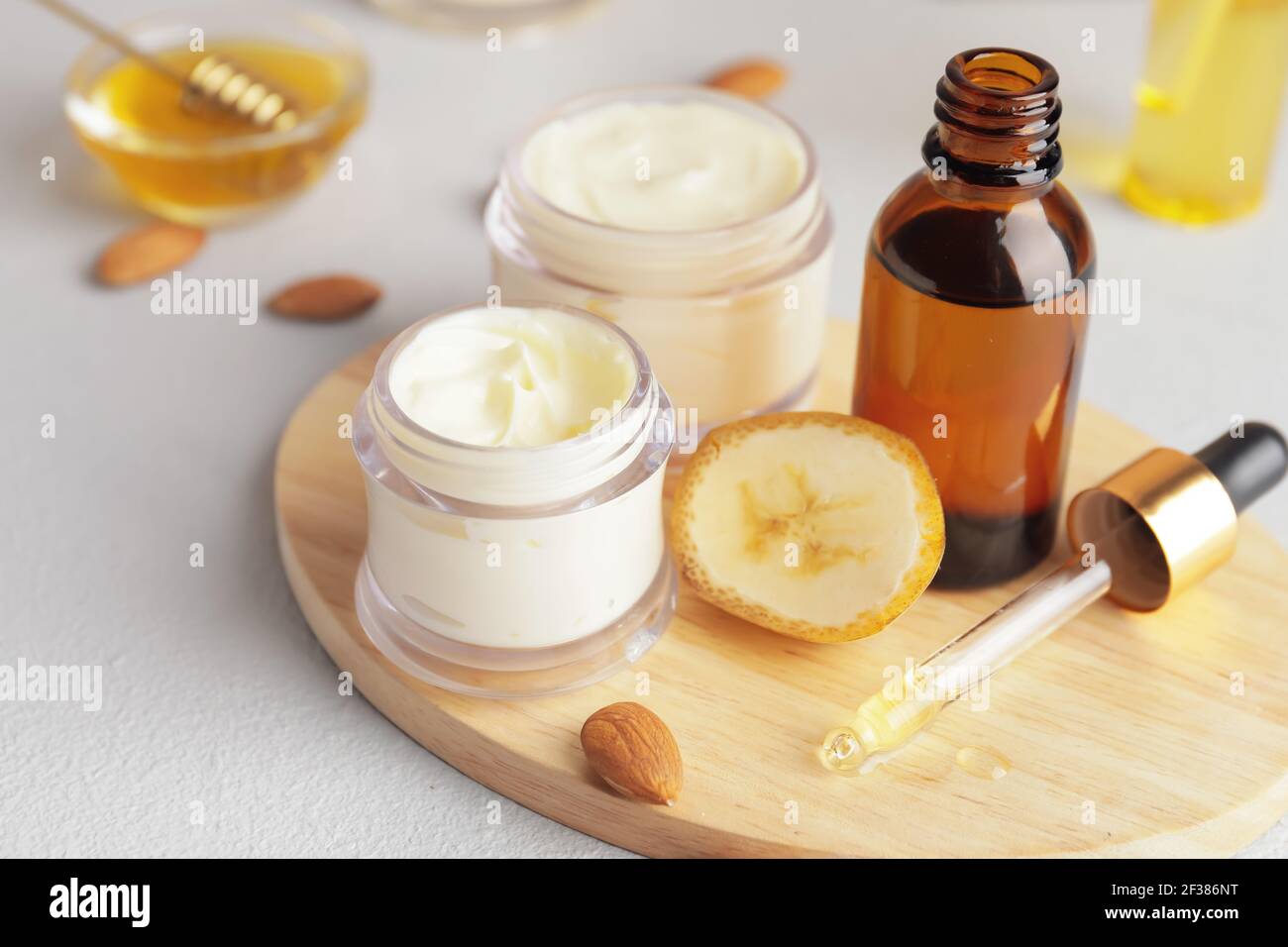 Composition with banana cosmetics on light background, closeup Stock ...