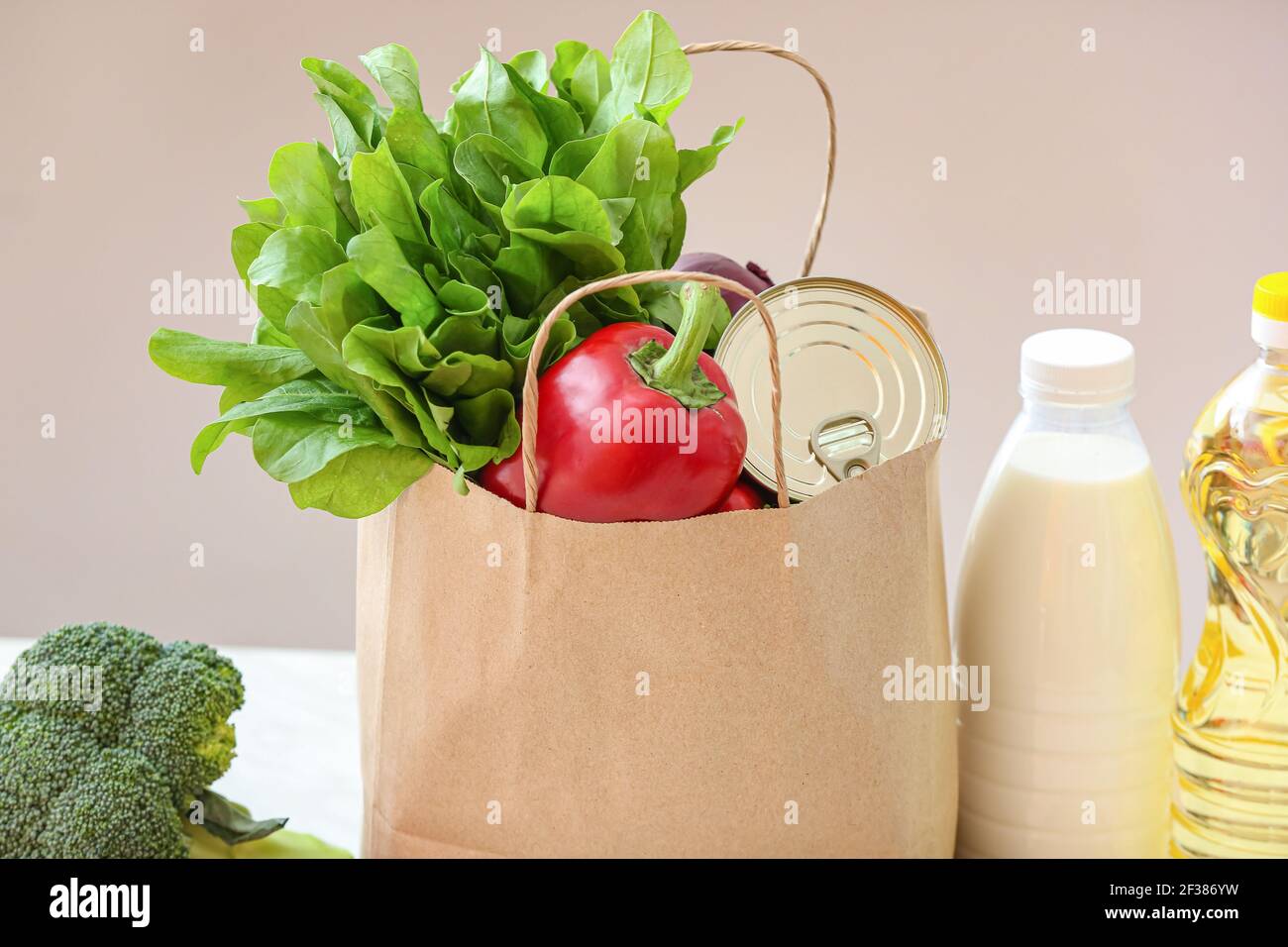 Paper bag with different products on table in kitchen Stock Photo - Alamy