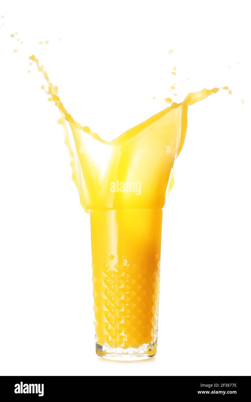 Glass of orange juice with splash on white background Stock Photo - Alamy
