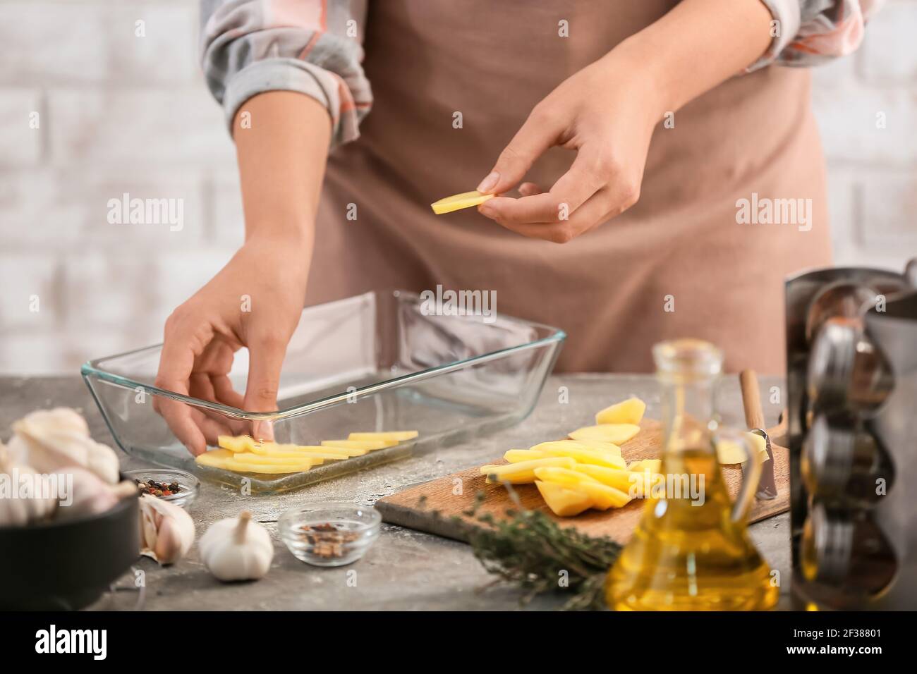 Woman hands cooking baked potatoes hi-res stock photography and images ...