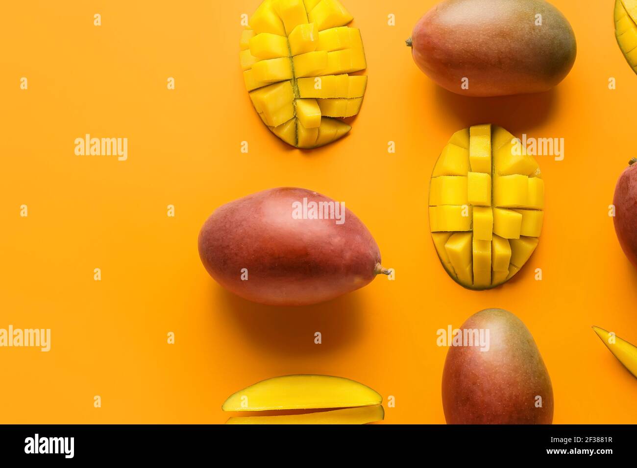 Sweet ripe mangoes on color background Stock Photo - Alamy