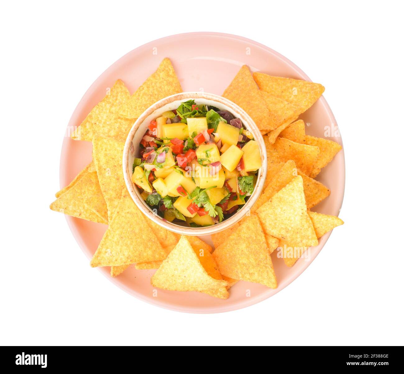 Plate with nachos and fresh mango salsa on white background Stock Photo ...