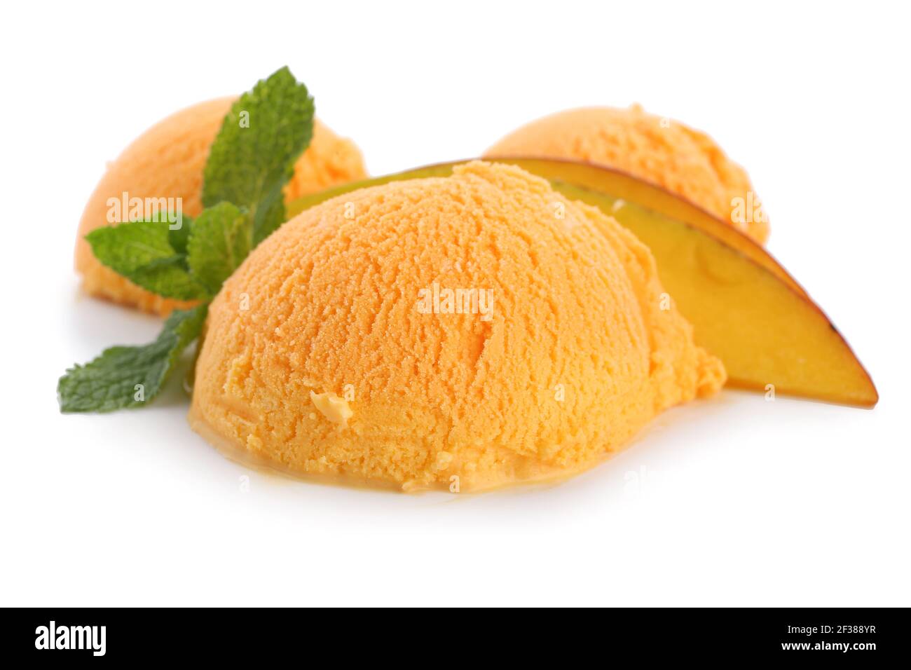 Tasty mango ice cream on white background Stock Photo - Alamy