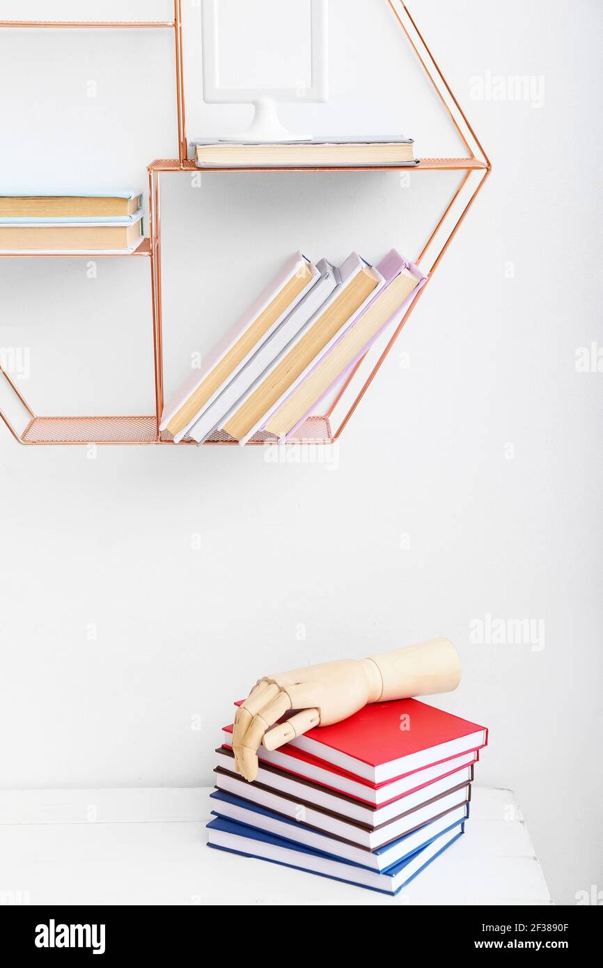Stack of books on table in room Stock Photo - Alamy
