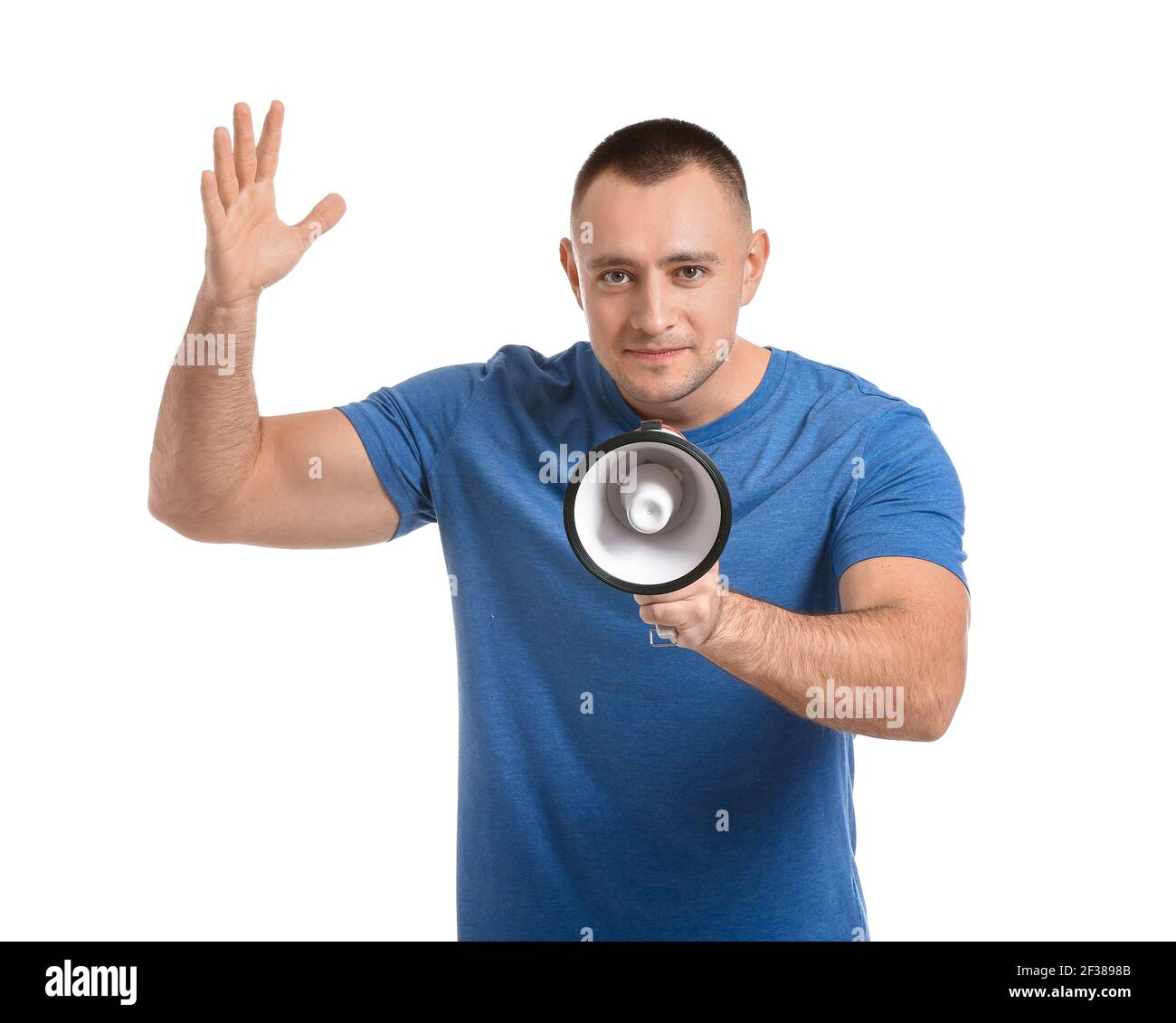 Young man talking into megaphone on white background Stock Photo - Alamy