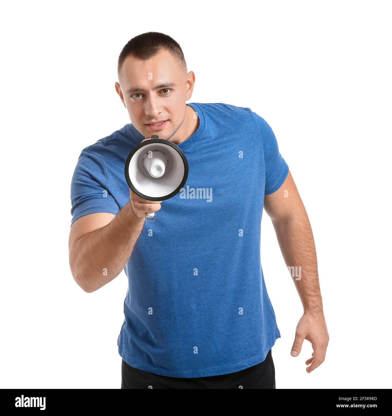 Handsome young man talking into megaphone on white background Stock ...