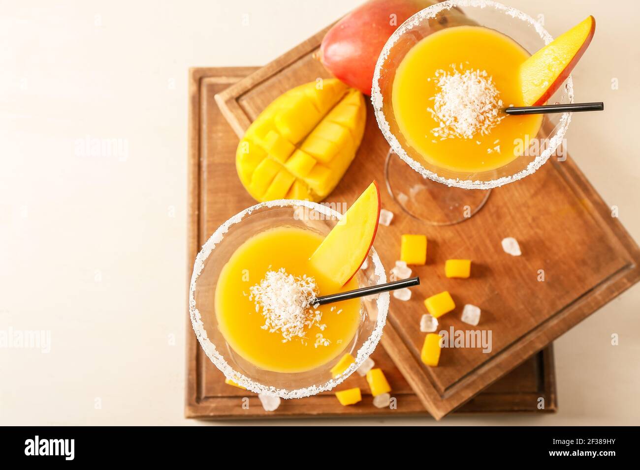 Glasses of mango margarita on table Stock Photo - Alamy