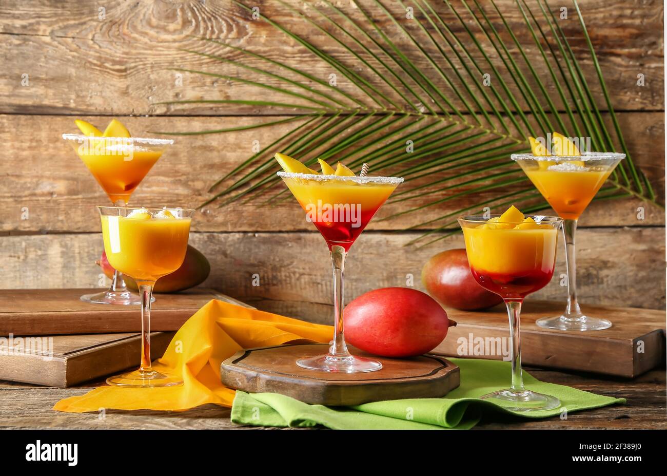 Glasses of mango margarita on wooden background Stock Photo - Alamy
