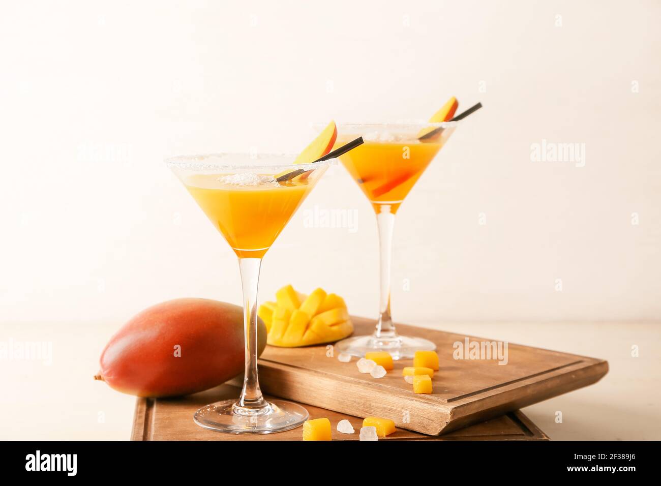 Glasses of mango margarita on table Stock Photo - Alamy