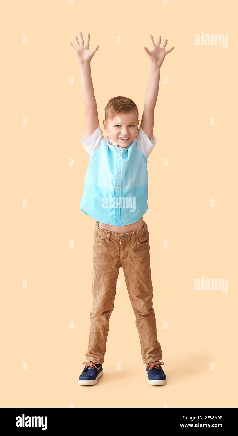 Cute little boy on light background Stock Photo - Alamy