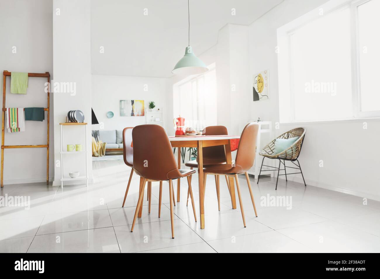 Dining table in interior of living room Stock Photo - Alamy