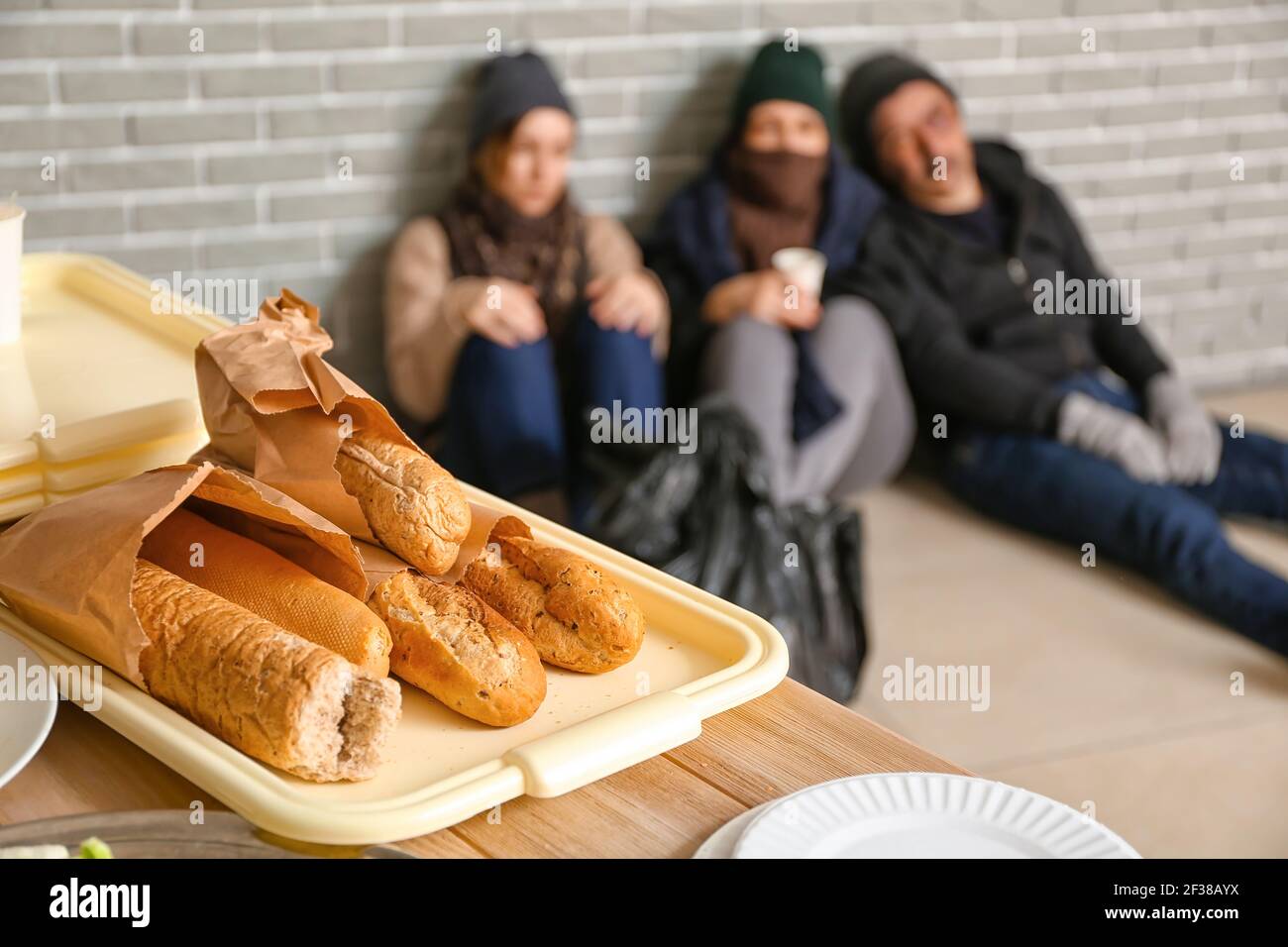 Bread for homeless people on table in warming center Stock Photo - Alamy