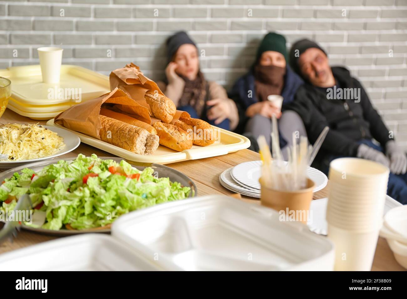 Homeless people eating in shelter hi-res stock photography and images ...
