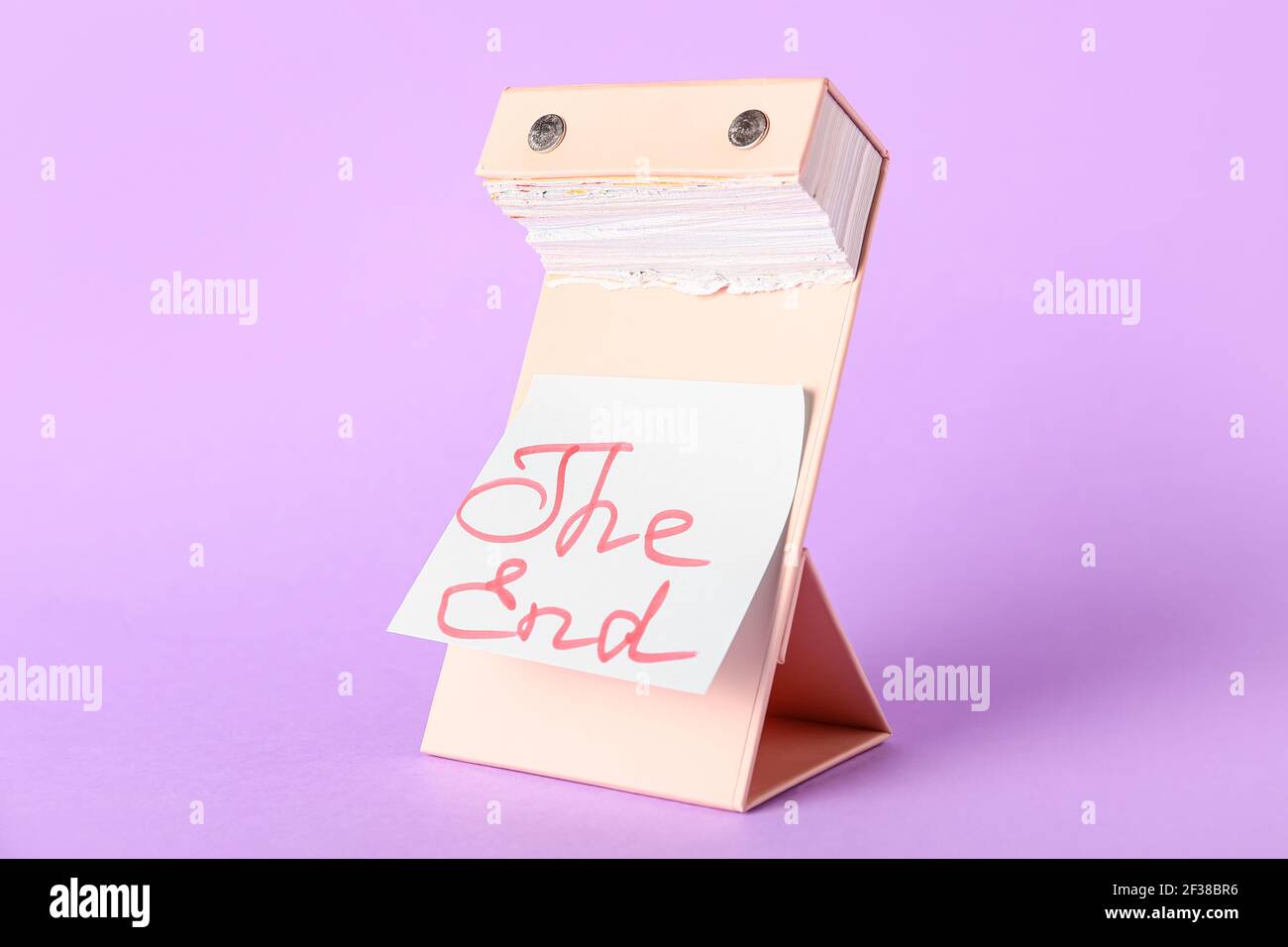 Tear-off calendar at the end of the year on color background Stock ...