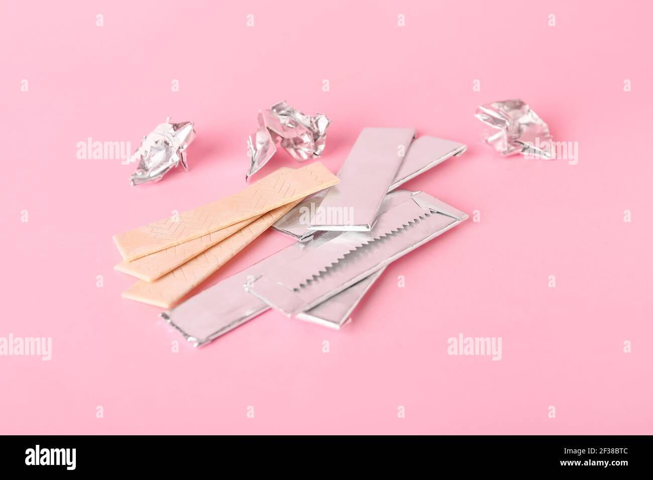 Tasty chewing gums on color background Stock Photo - Alamy