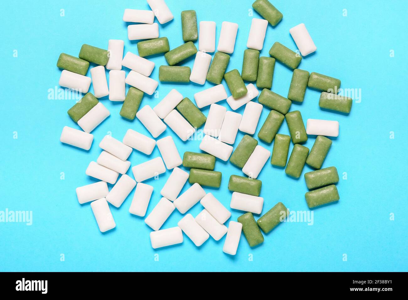 Tasty chewing gums on color background Stock Photo - Alamy
