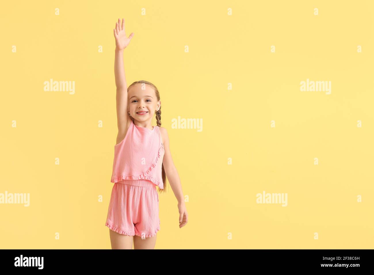 Cute little girl on color background Stock Photo - Alamy