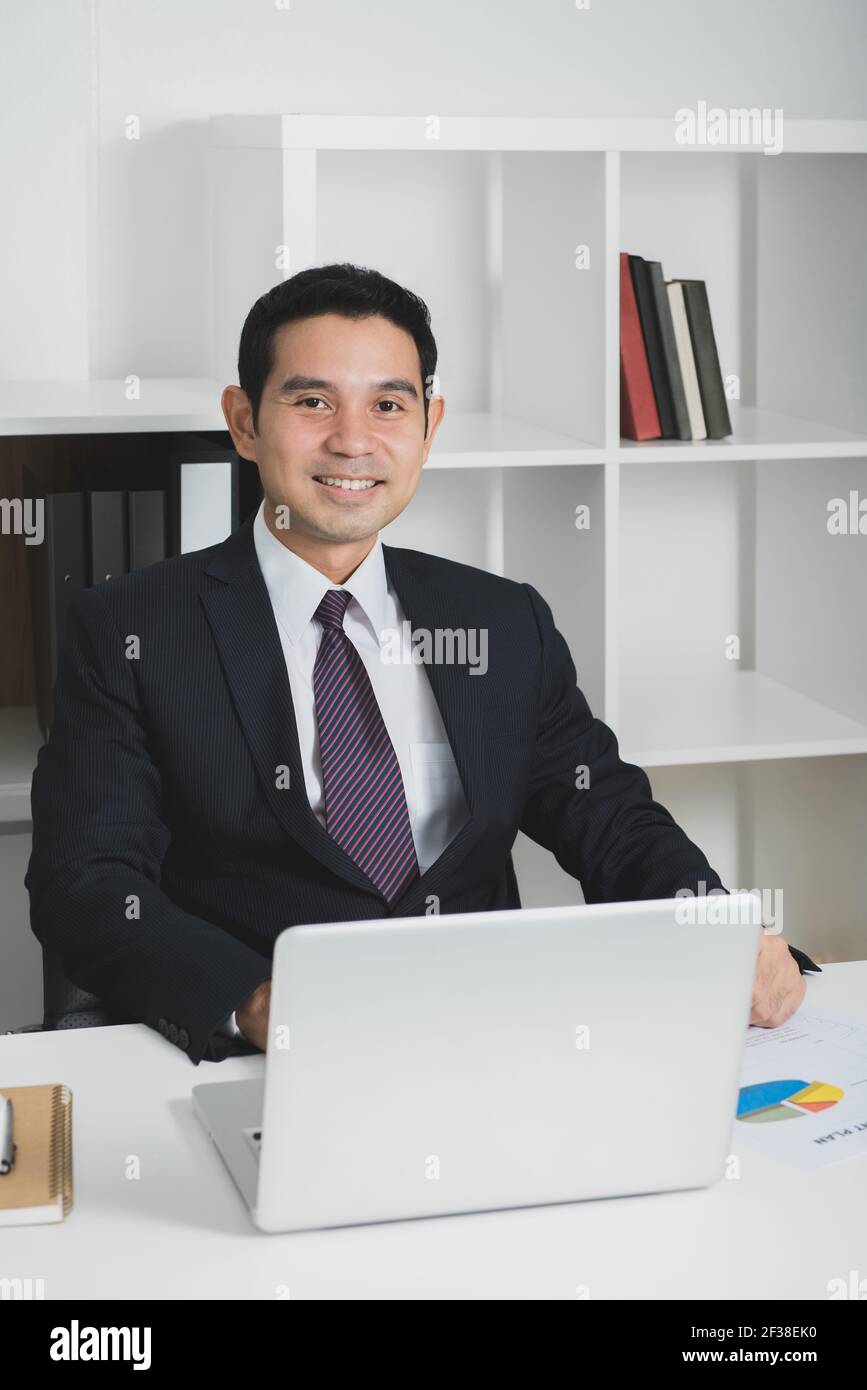 Asian man laptop desk hi-res stock photography and images - Alamy