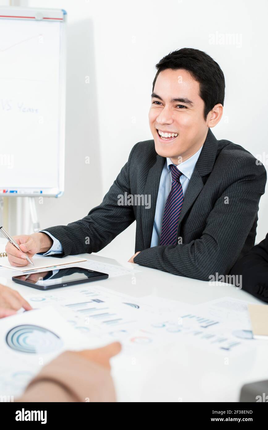 Businessman smiling young attractive hi-res stock photography and ...