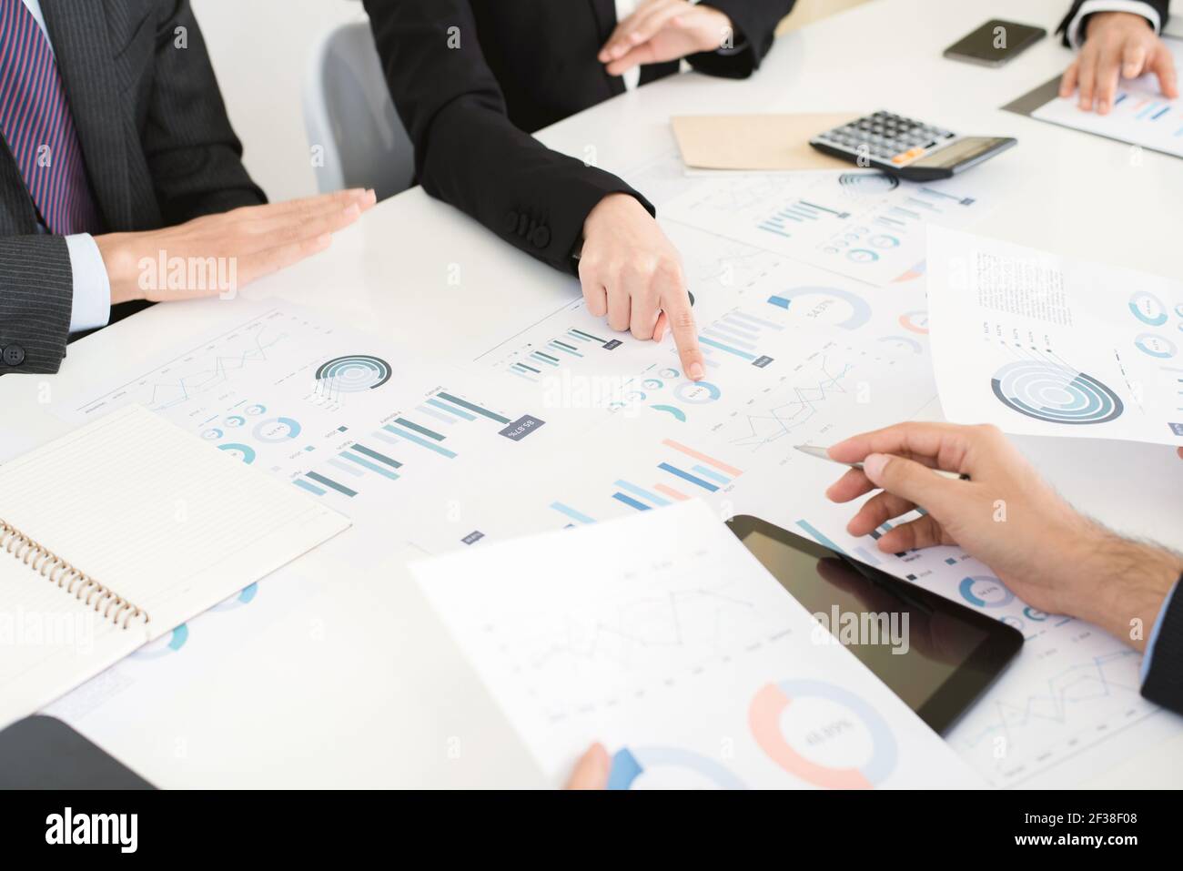 Business people discussing documents at the meeting - brainstorming concept Stock Photo - Alamy