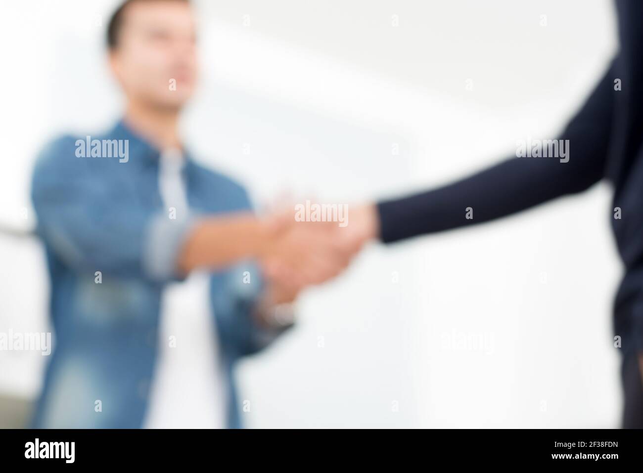 Blur casual businessmen making handshake, can be used as background ...