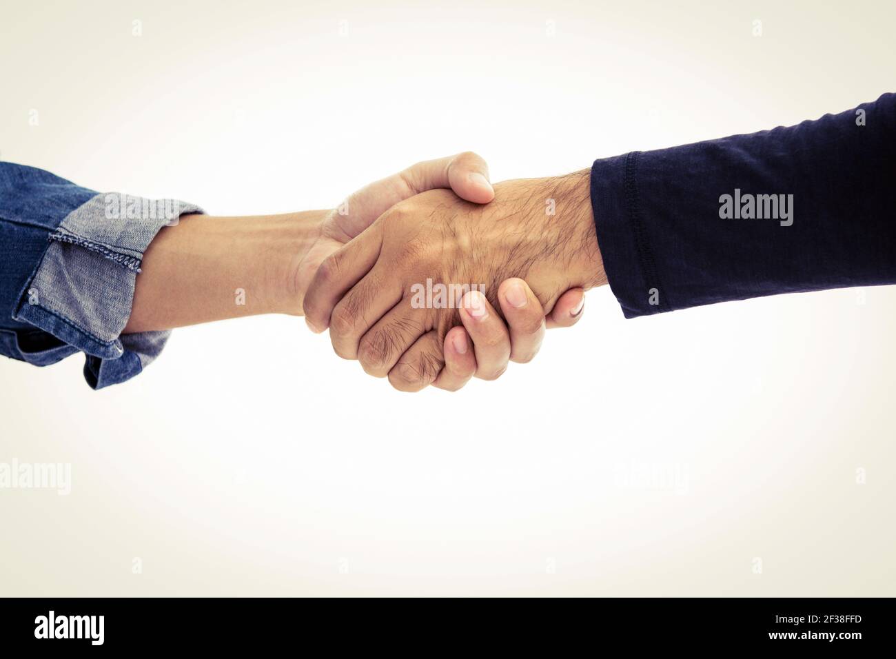 Hands of two men wearing casual clothes making handshake Stock Photo ...