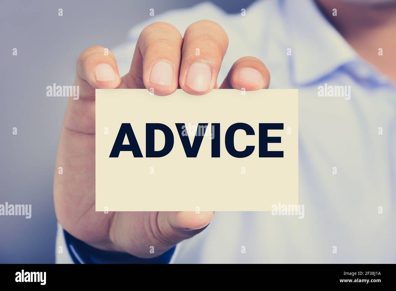 ADVICE word on the card shown by a man Stock Photo - Alamy