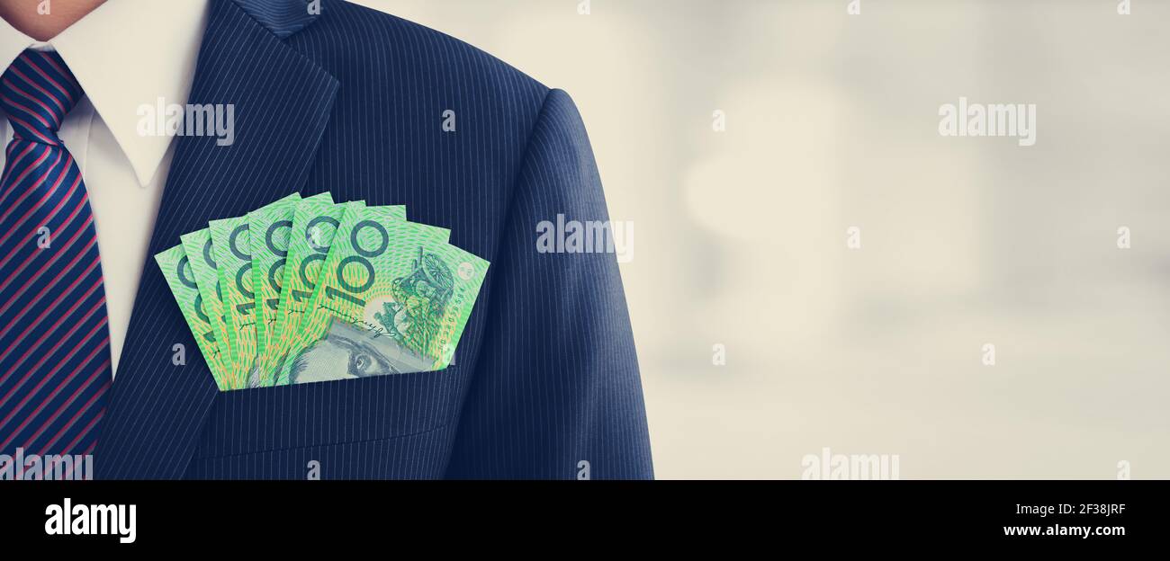 Money,Australian dollar (AUD) banknotes, in businessman suit pocket ...