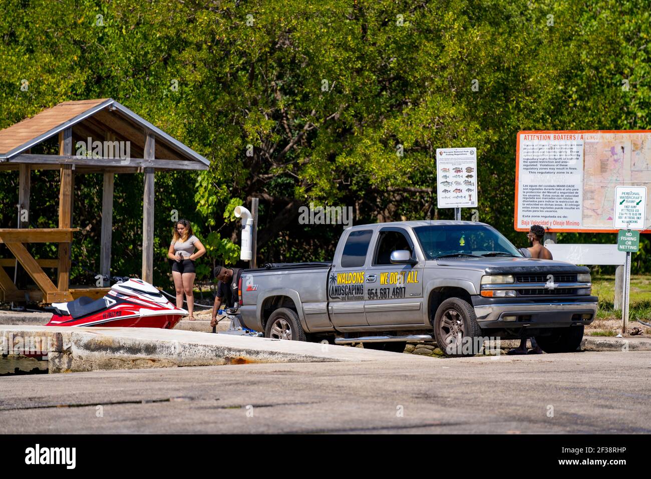 Chevy truck loading a jet ski wave runner into the water at the ...