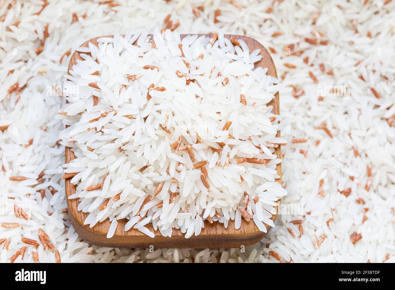 Close up white rice mix with red rice in a wooden cup on rice ...