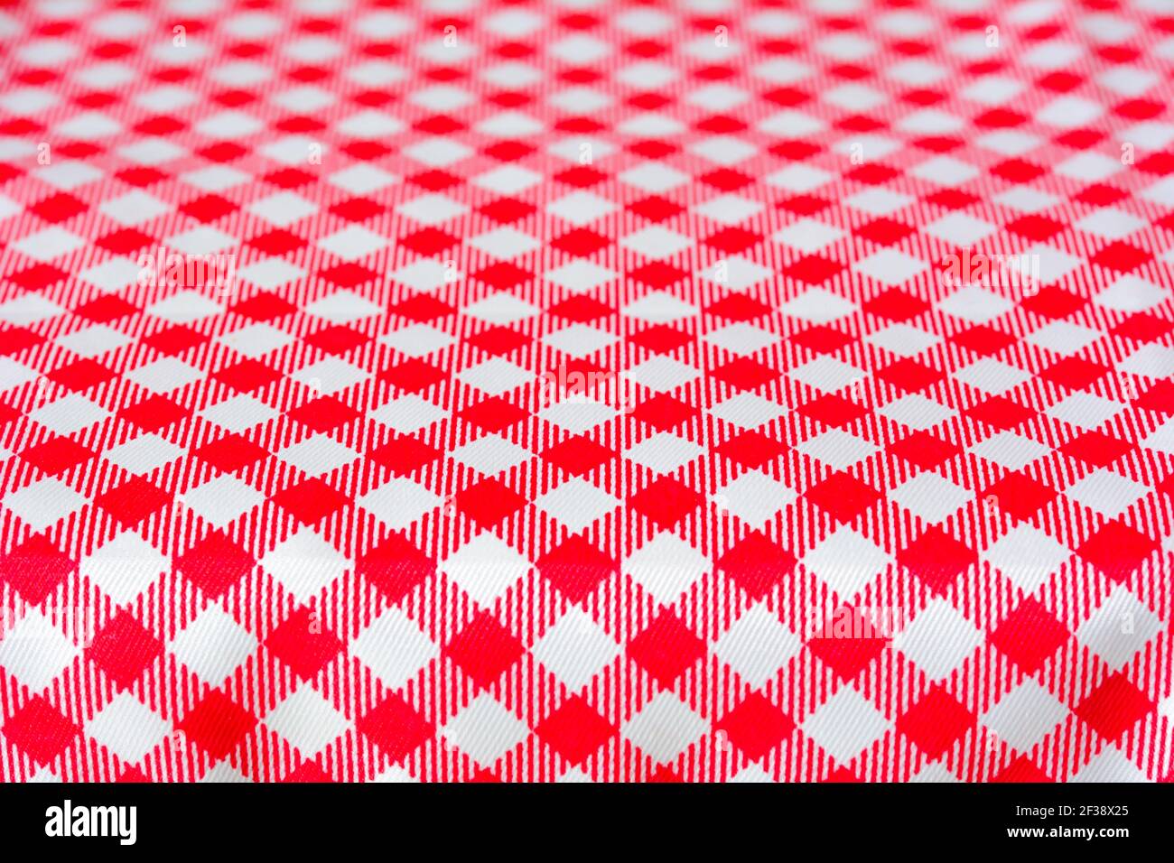 Table covered with red checkered picnic tablecloth - can be used as ...