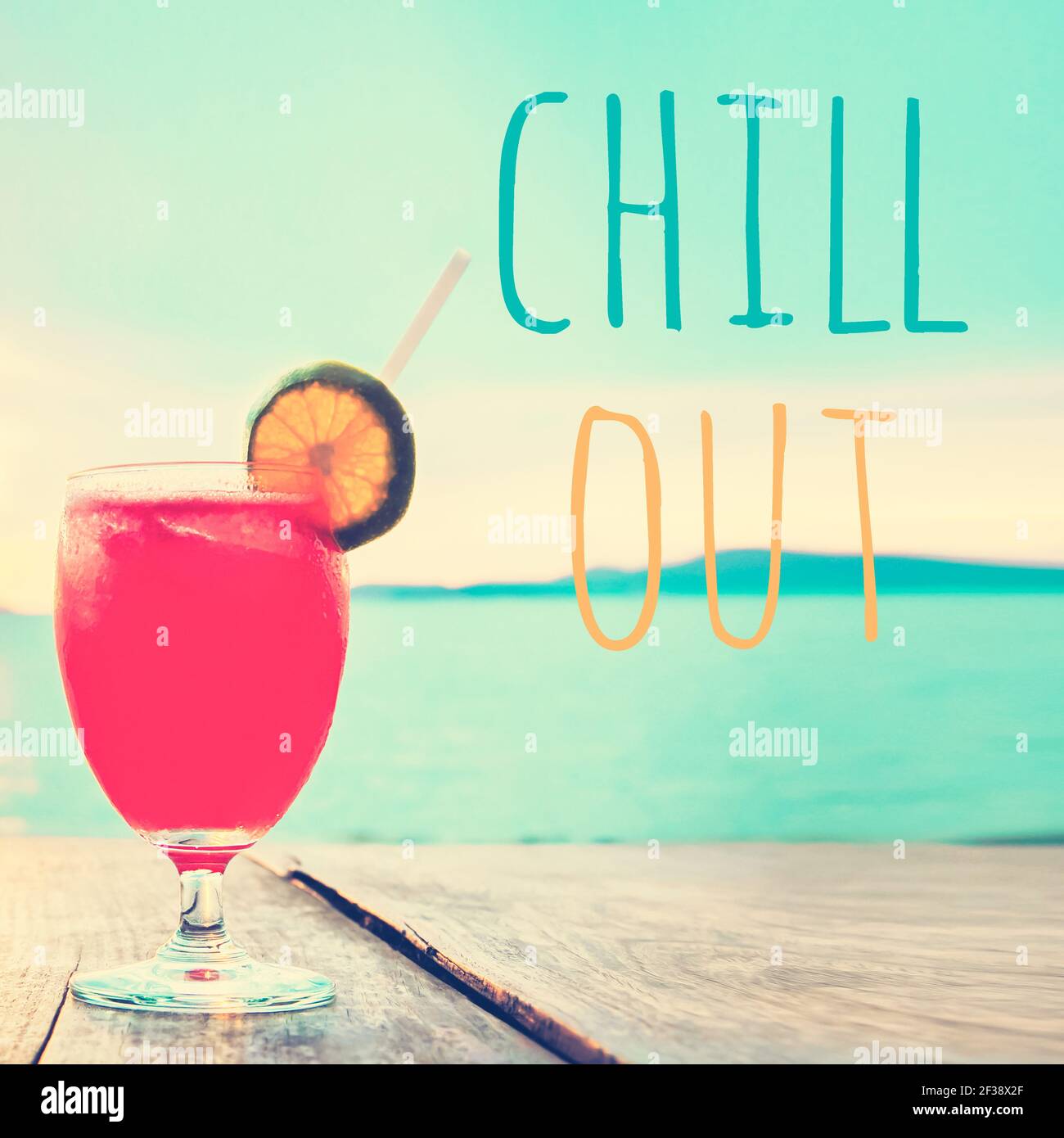 Cocktail drink on wood table in summer sea and sky background, vintage ...