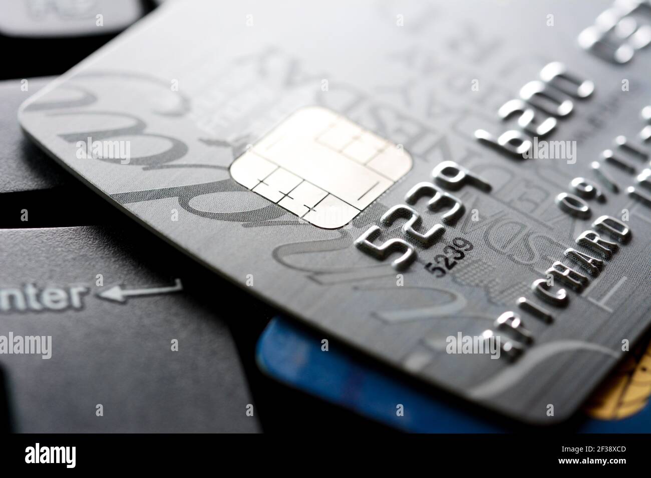 Close up of credit card with chip and numbers, gray and silver theme ...