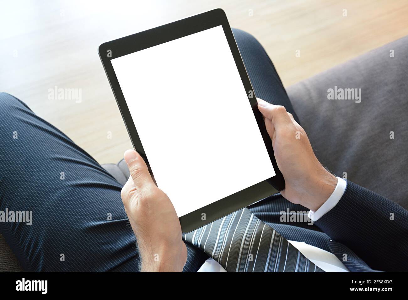 White Empty screen tablet pc held by businessman hands Stock Photo - Alamy